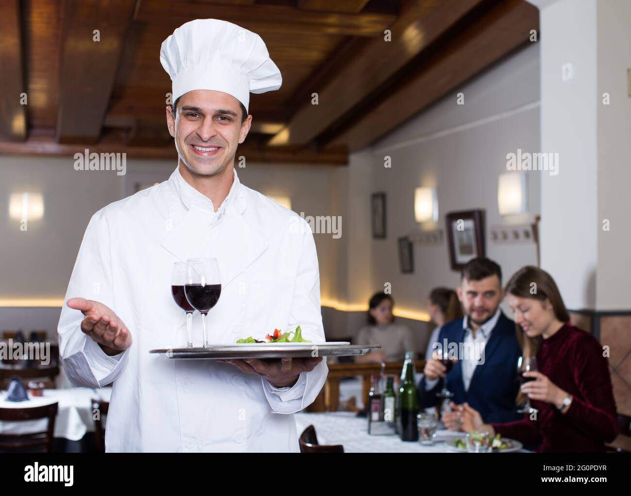 Professional chef with serving tray Stock Photo - Alamy