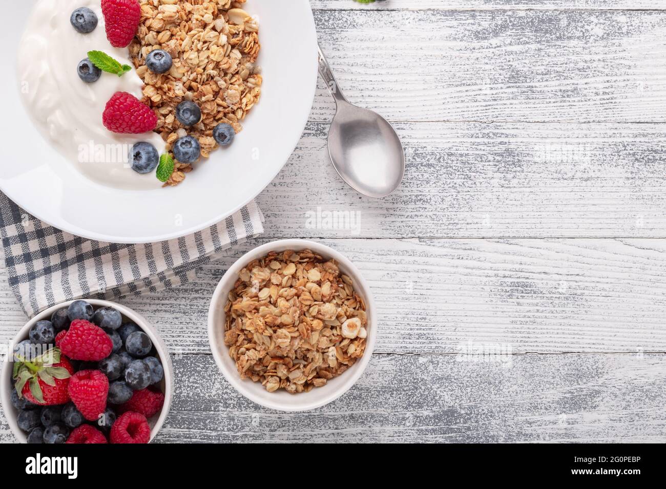Healthy breakfast with baked granola and greek yogurt. Assorted fresh ...