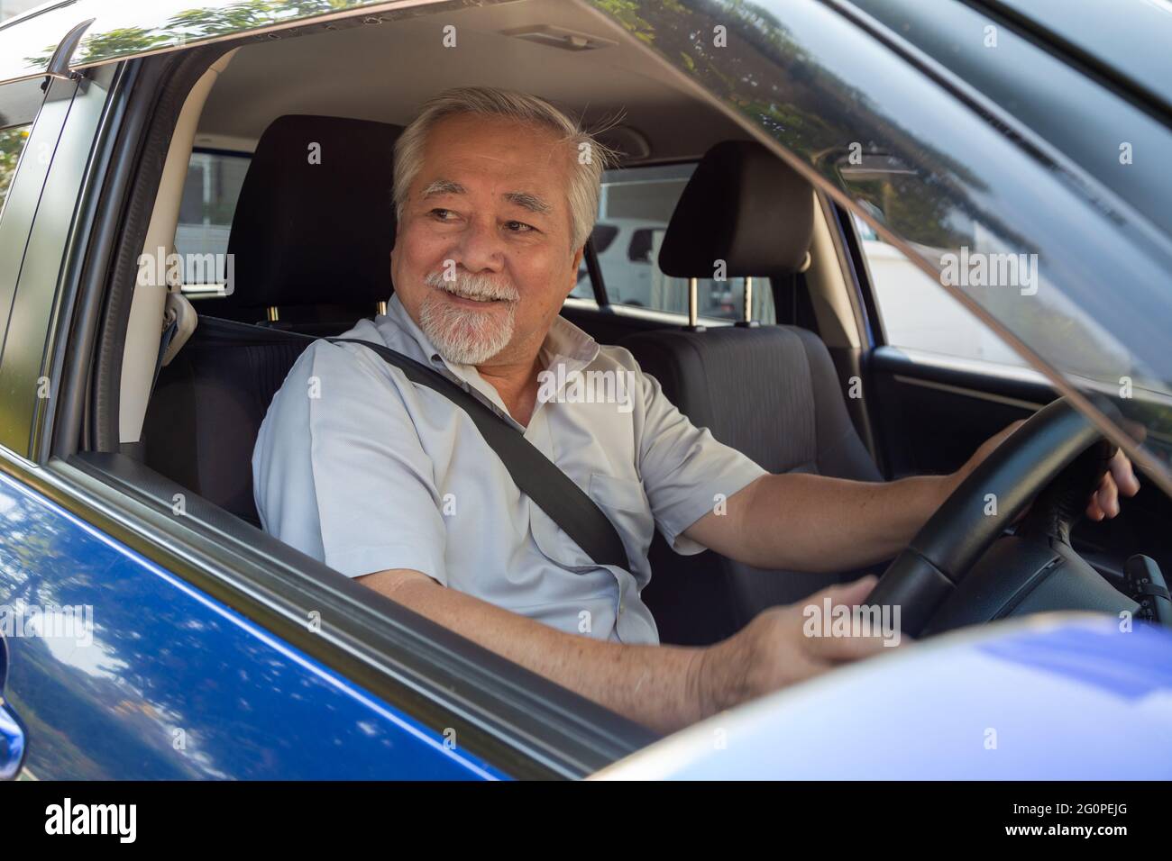 Asian senior men driving a car and smile happily with glad positive ...