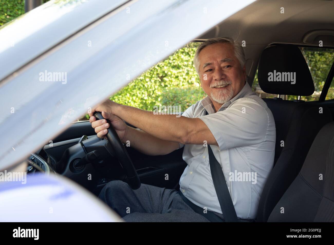 Asian senior men driving a car and smile happily with glad positive ...