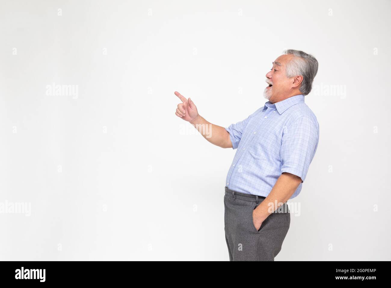 Smiling senior man pointing towards something, Happy Asian old man ...