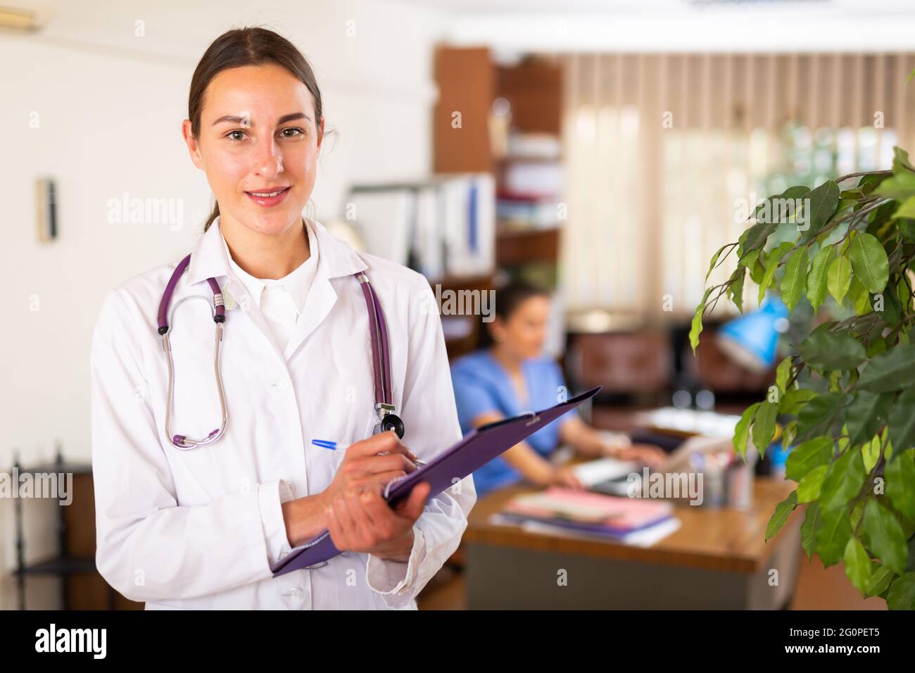 Portrait of female doctor standing in modern clinic Stock Photo - Alamy
