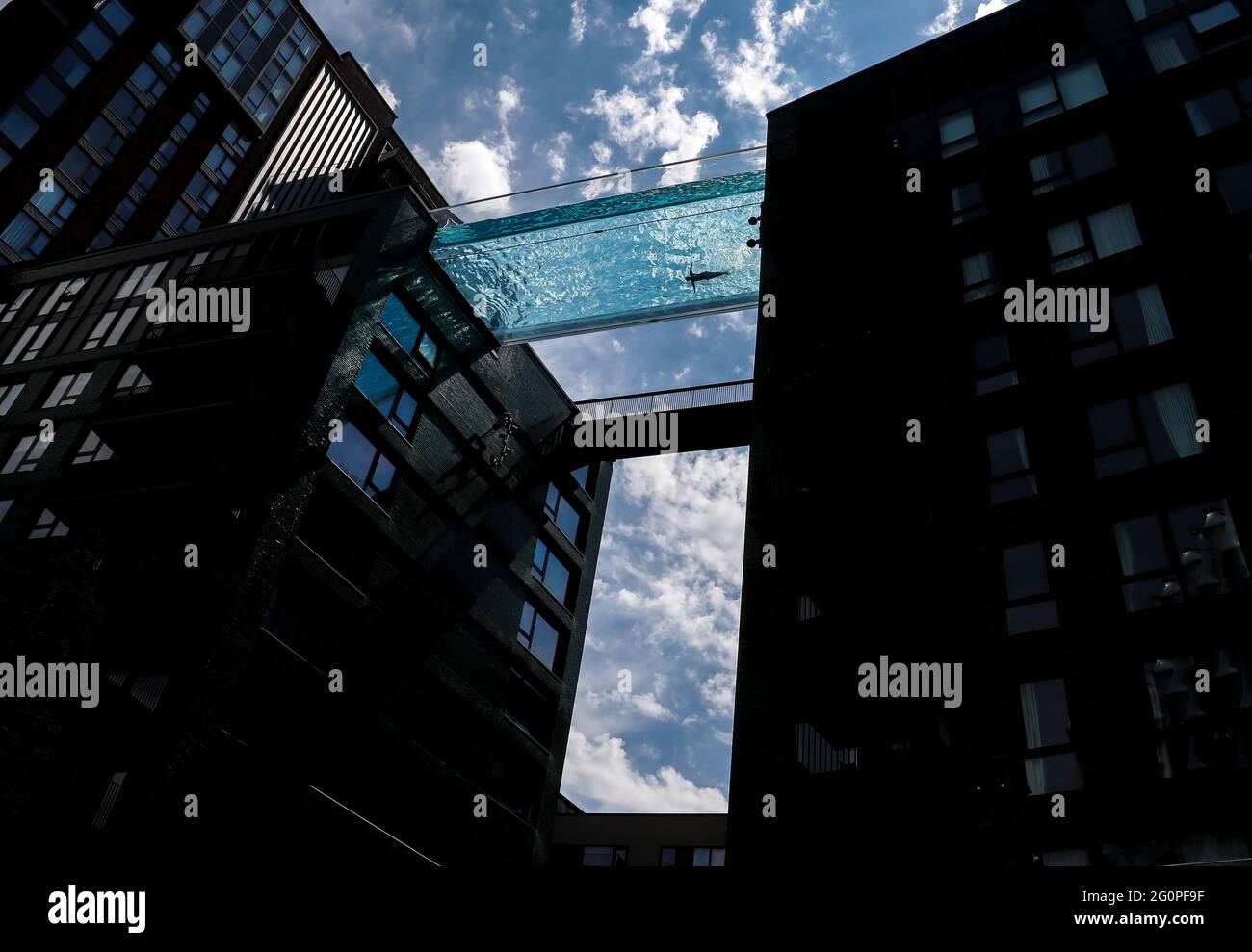 London, Britain. 2nd June, 2021. A person swims in the Sky Pool, a ...