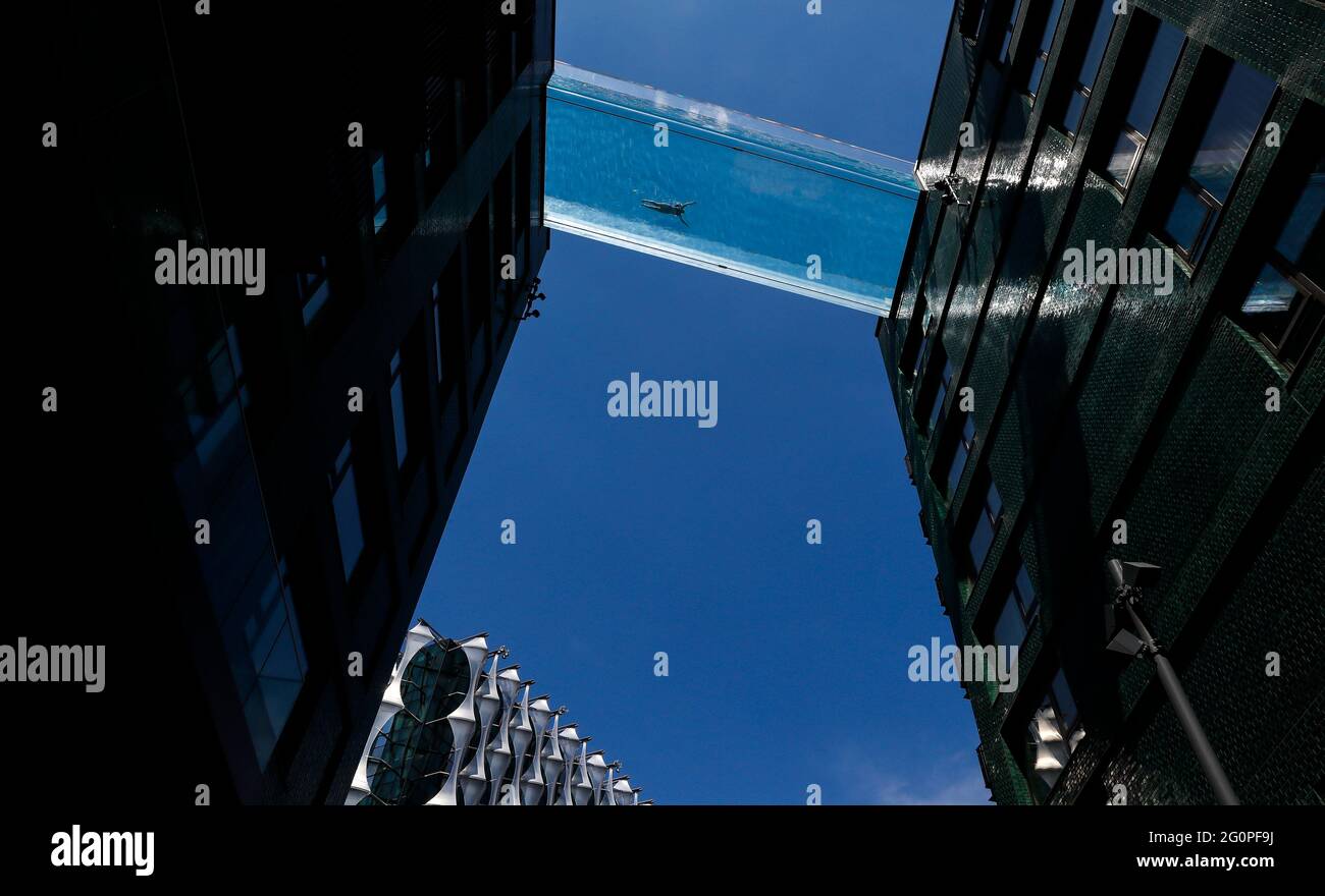 London, Britain. 2nd June, 2021. A person swims in the Sky Pool, a ...