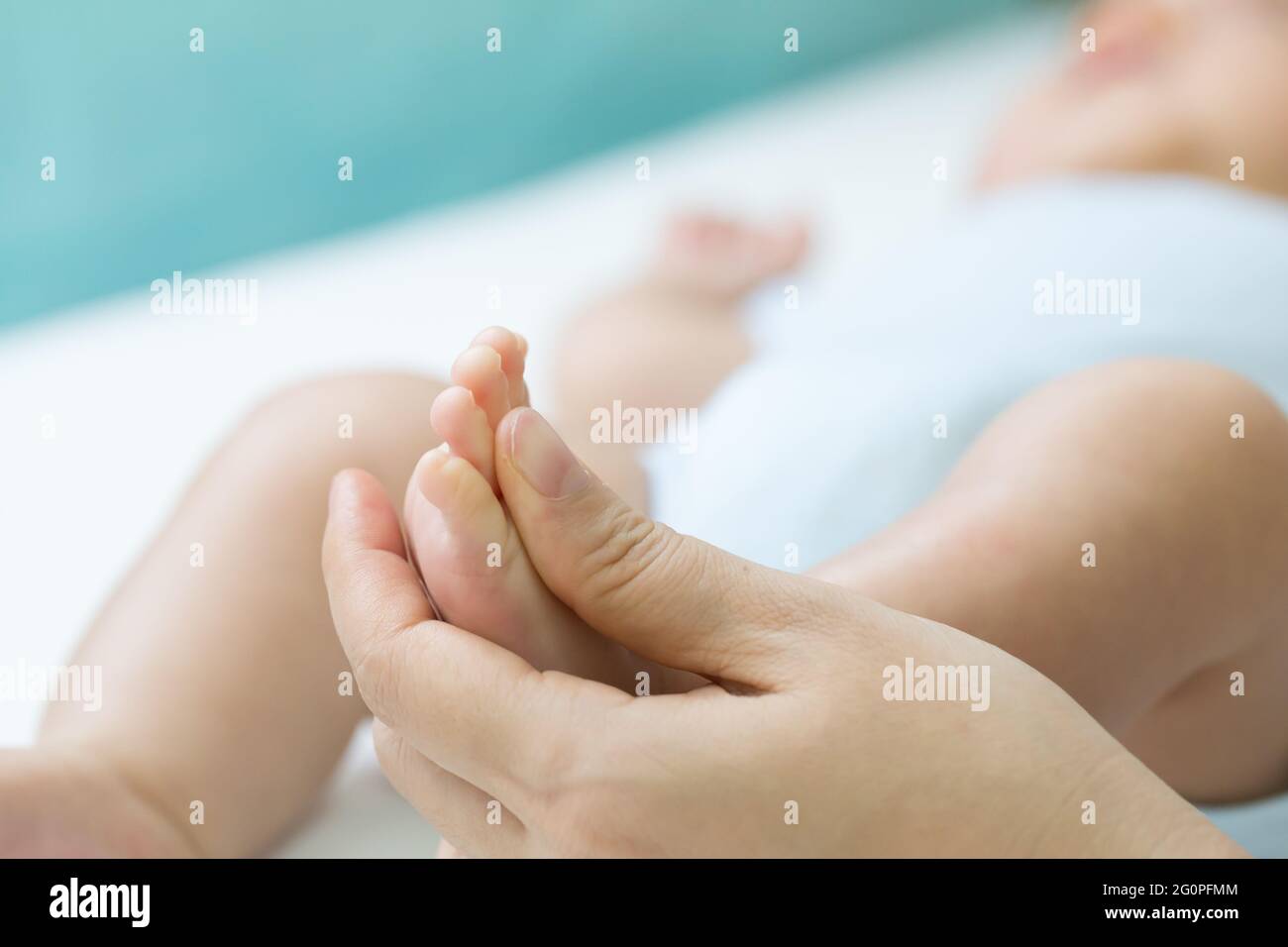 Reflexotherapy of the feet of a newborn baby, Massage foot of the child ...