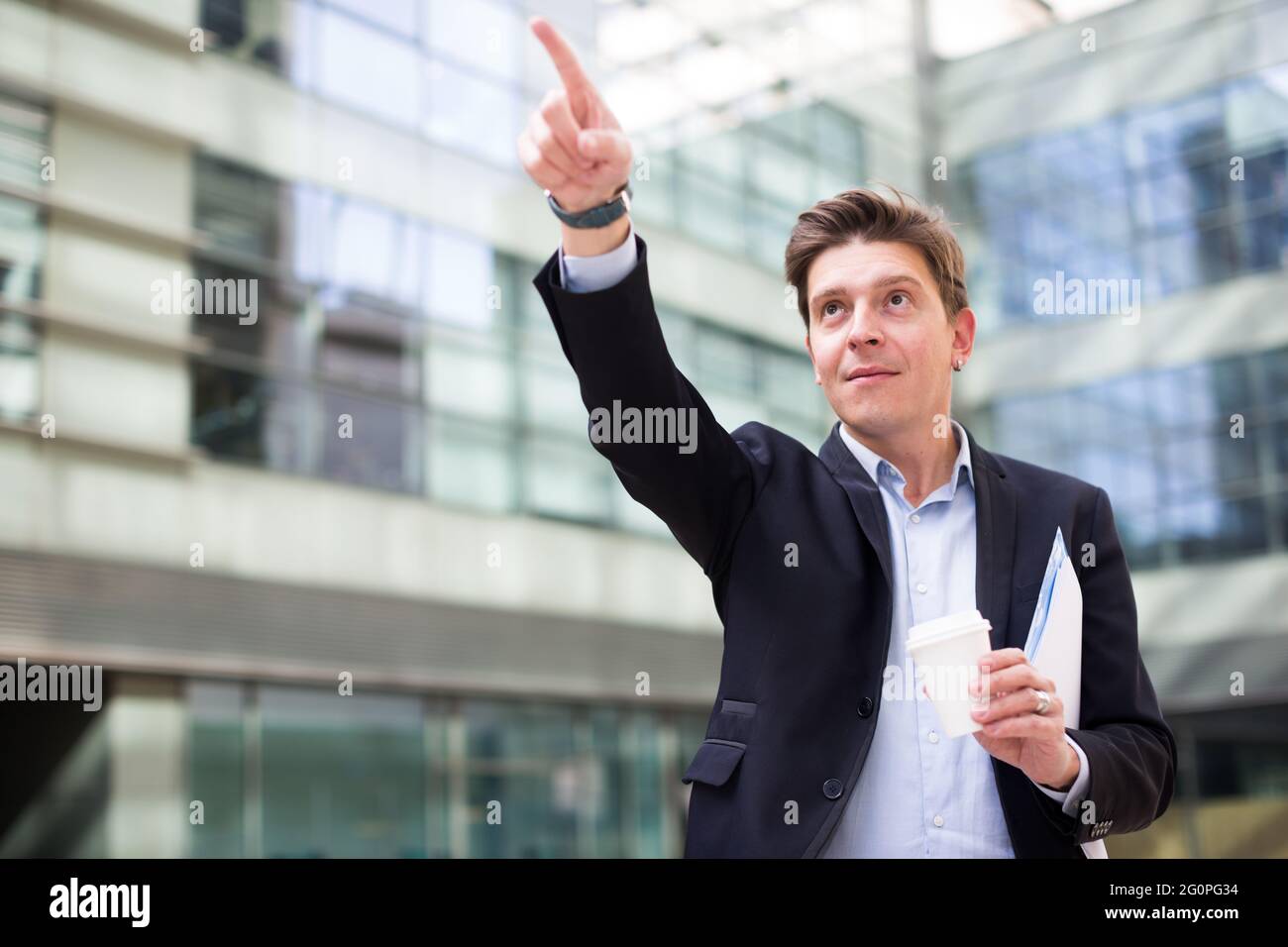 Male pointing finger at object Stock Photo - Alamy