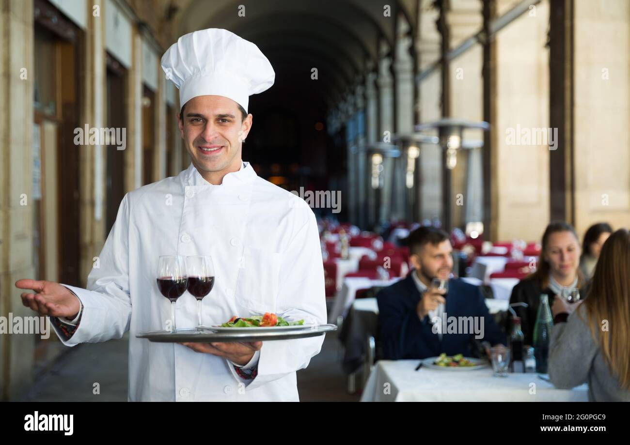 Restaurant chef with serving tray Stock Photo - Alamy