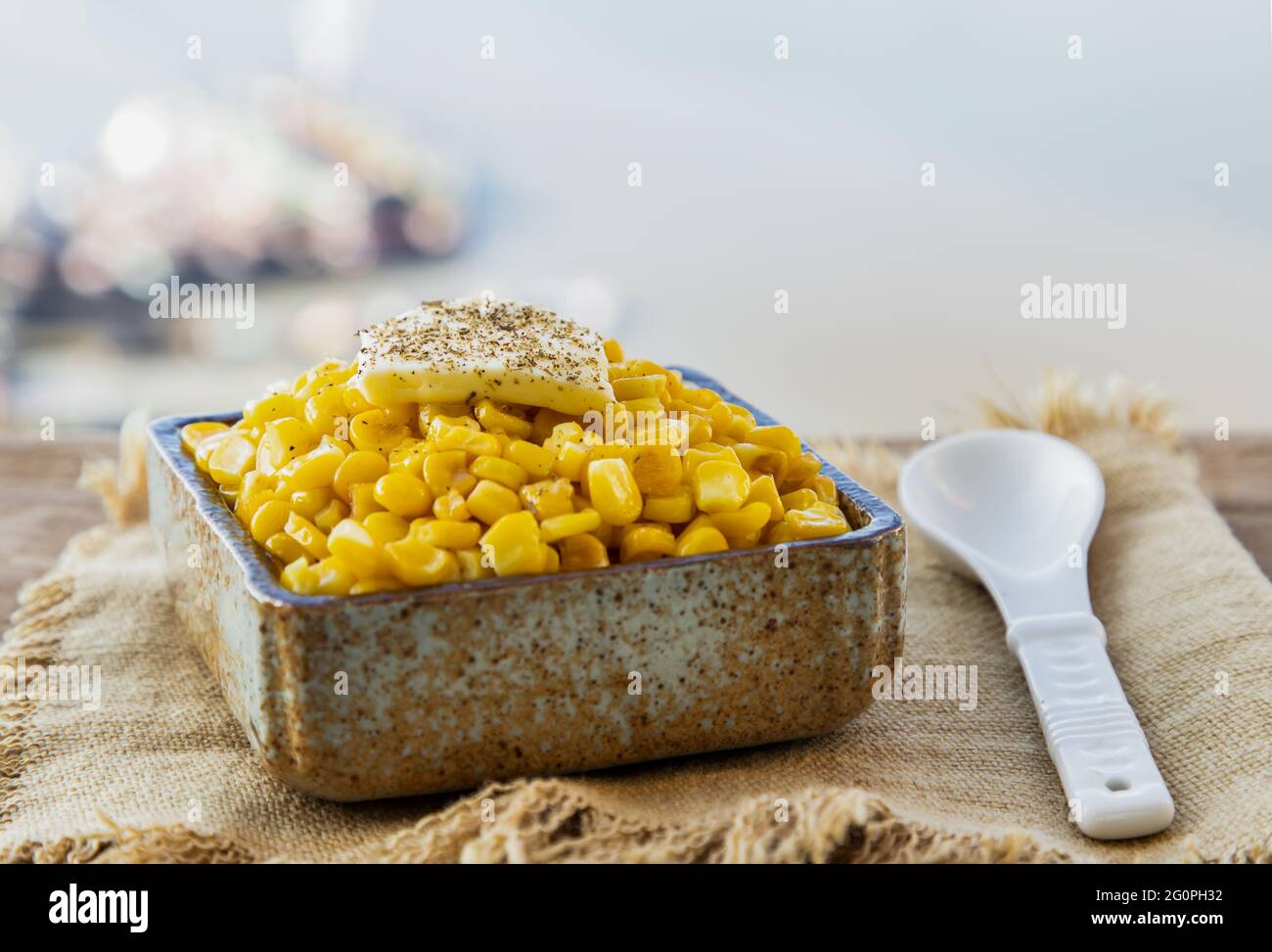 Fried sweet corn with a knob of butter and seasonings Sprinkle with ...