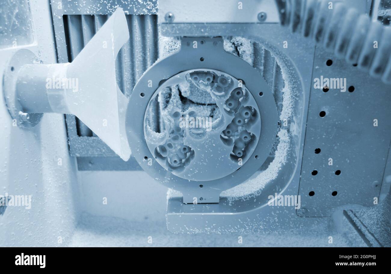 Dental milling machine carving out shape of human teeth Stock Photo - Alamy