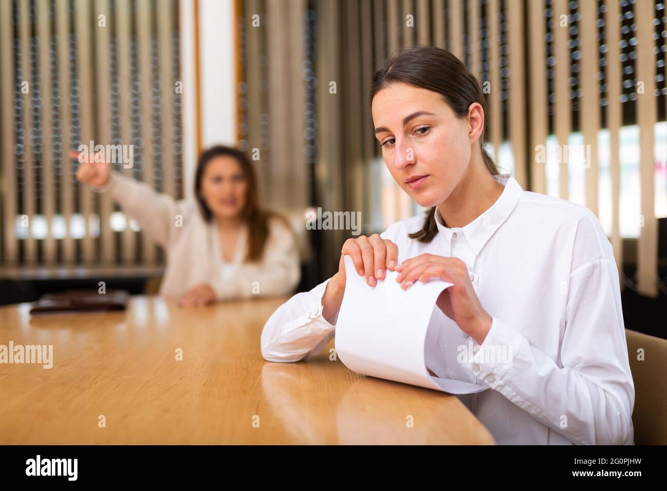 Portrait of frustrated woman holding dismissal letter Stock Photo - Alamy