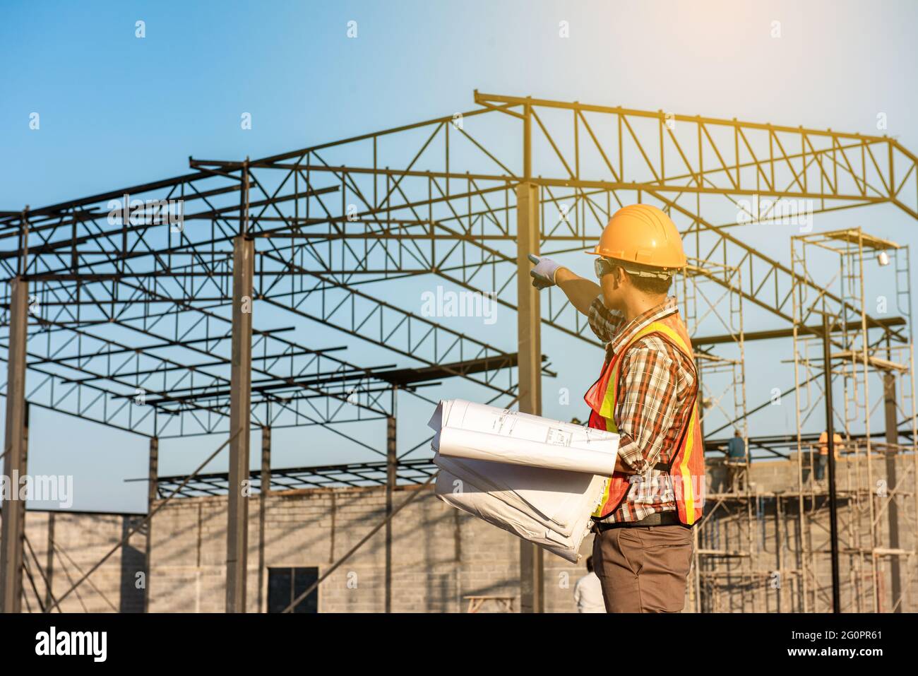 Engineers discussion with architects work planing in construction site ...