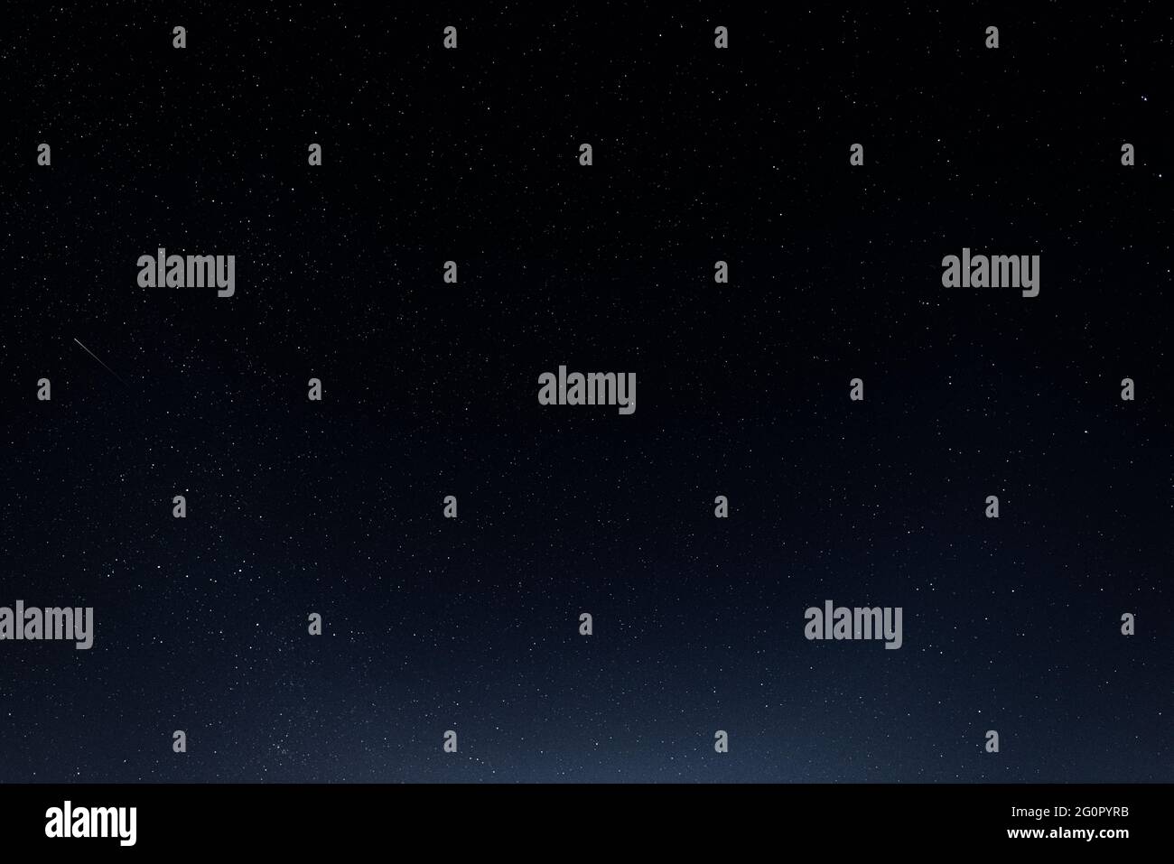 A starry sky with many stars and a flying meteor Stock Photo - Alamy