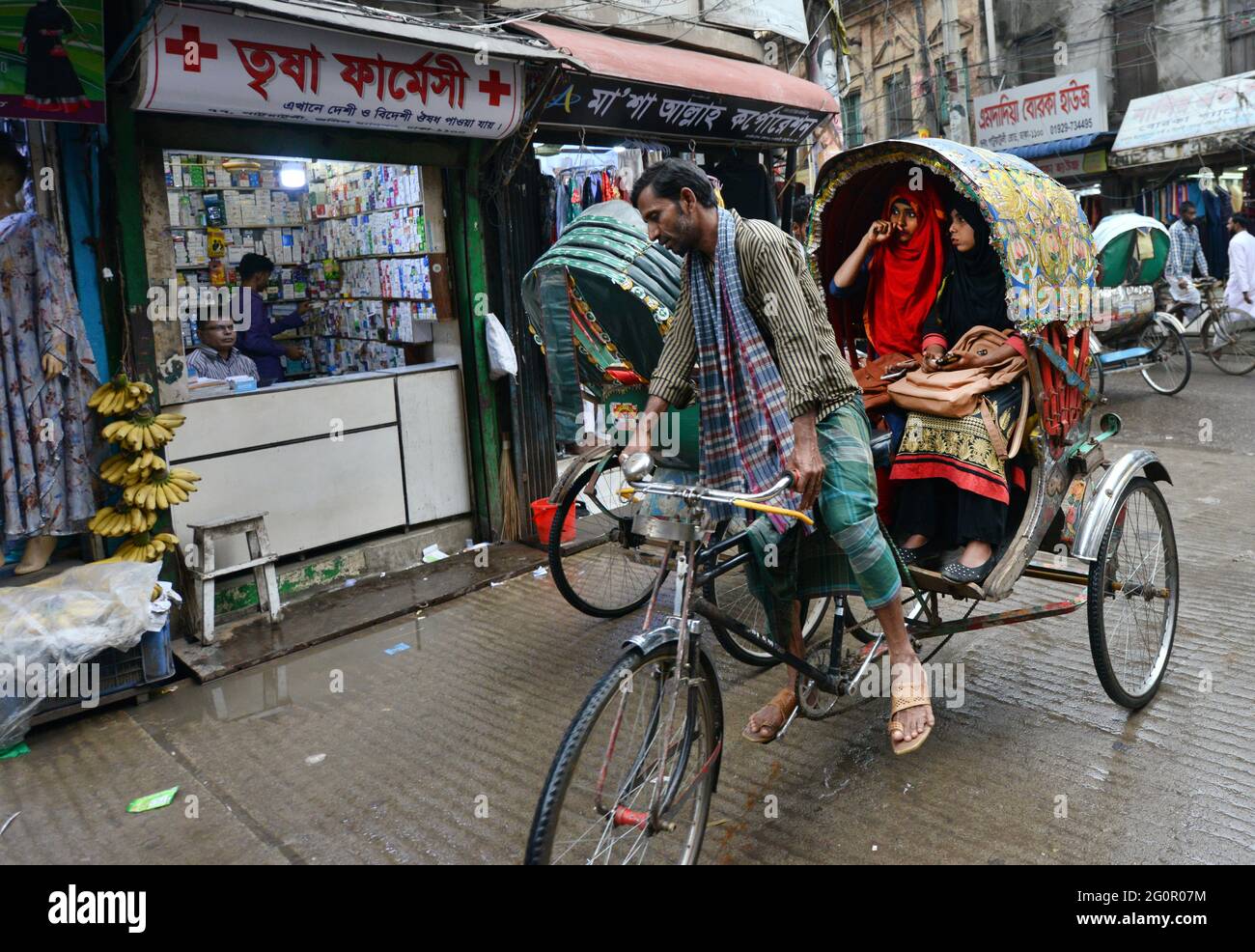Colorful cycle rickshaws roaming the streets of Dhaka, Bangladesh Stock ...
