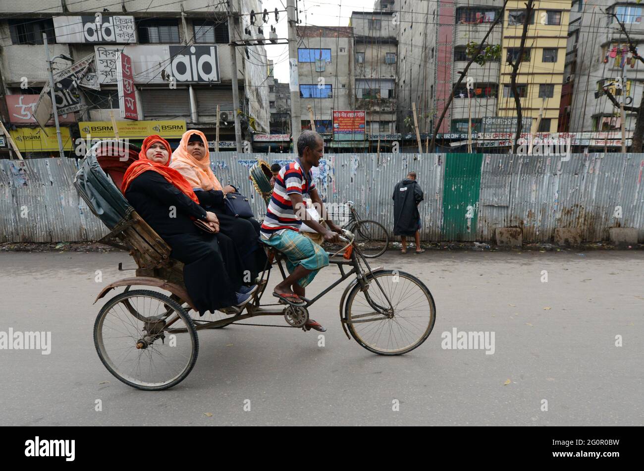 Colorful cycle rickshaws roaming the streets of Dhaka, Bangladesh Stock Photo - Alamy