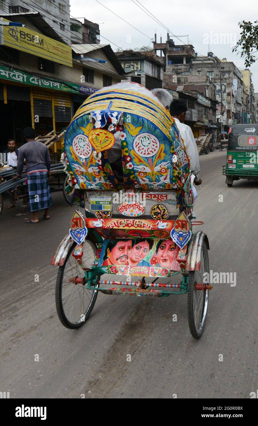 Colorful cycle rickshaws roaming the streets of Dhaka, Bangladesh Stock ...