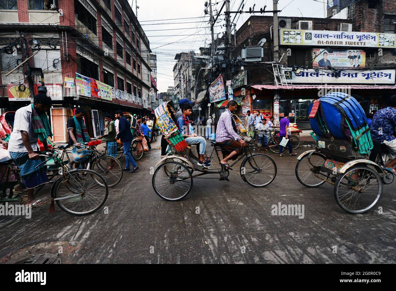 Colorful cycle rickshaws roaming the streets of Dhaka, Bangladesh Stock ...