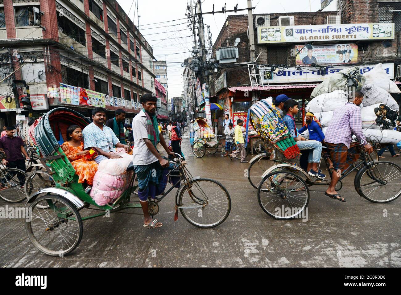 Colorful cycle rickshaws roaming the streets of Dhaka, Bangladesh Stock ...