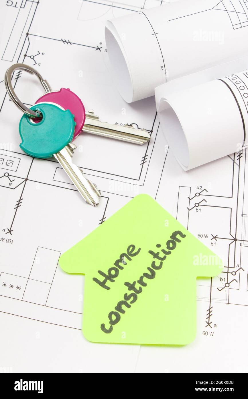 House shape made of paper, home keys and diagrams of plan with ...