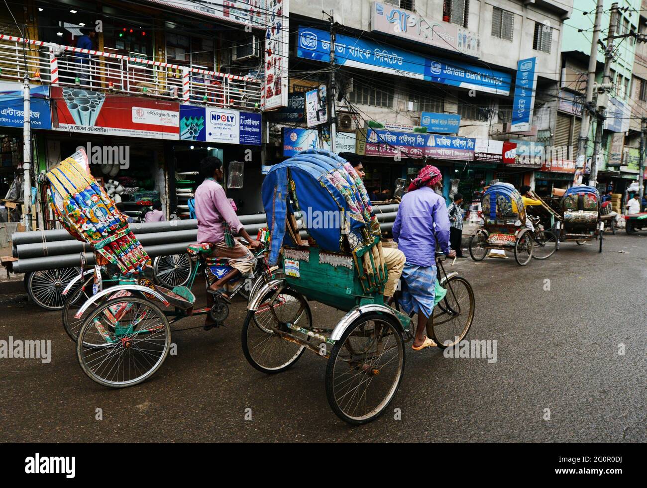 Colorful cycle rickshaws roaming the streets of Dhaka, Bangladesh Stock ...