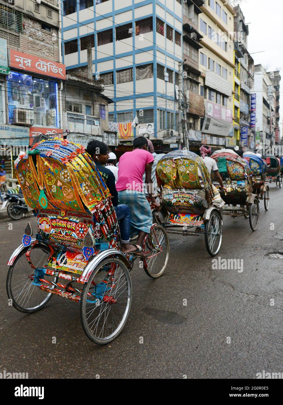 Colorful cycle rickshaws roaming the streets of Dhaka, Bangladesh Stock ...