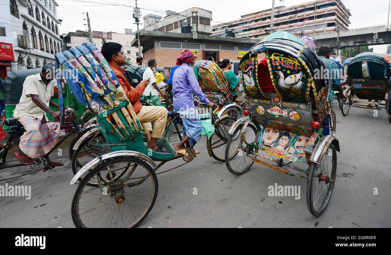 Colorful cycle rickshaws roaming the streets of Dhaka, Bangladesh Stock ...