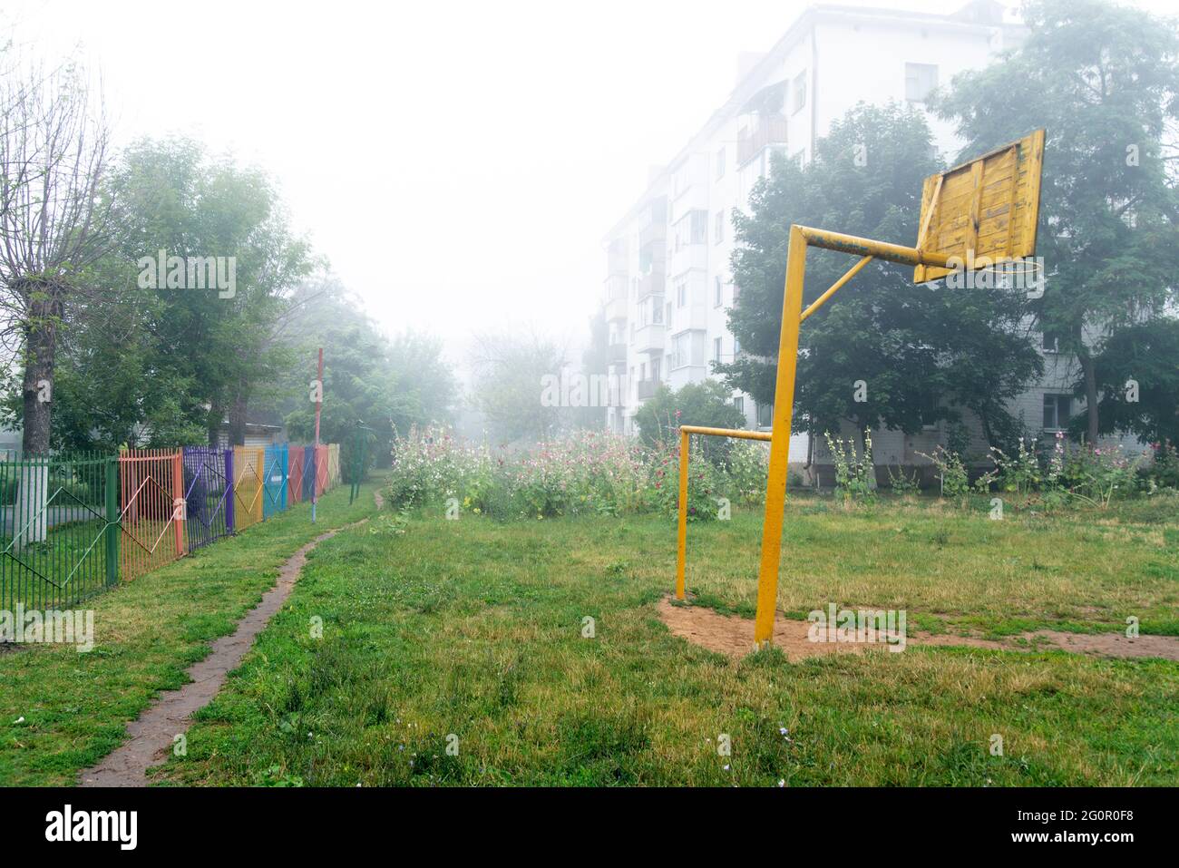 Russian courtyard on a foggy spring morning Stock Photo - Alamy
