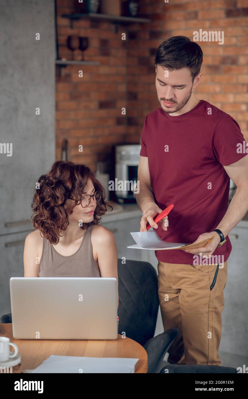 Young professionals working together and looking interested Stock Photo ...