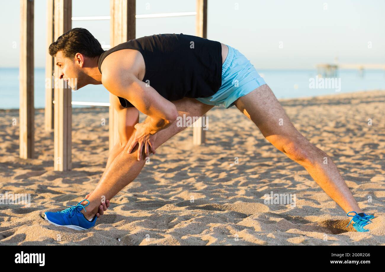 Man doing stretching exercises Stock Photo - Alamy