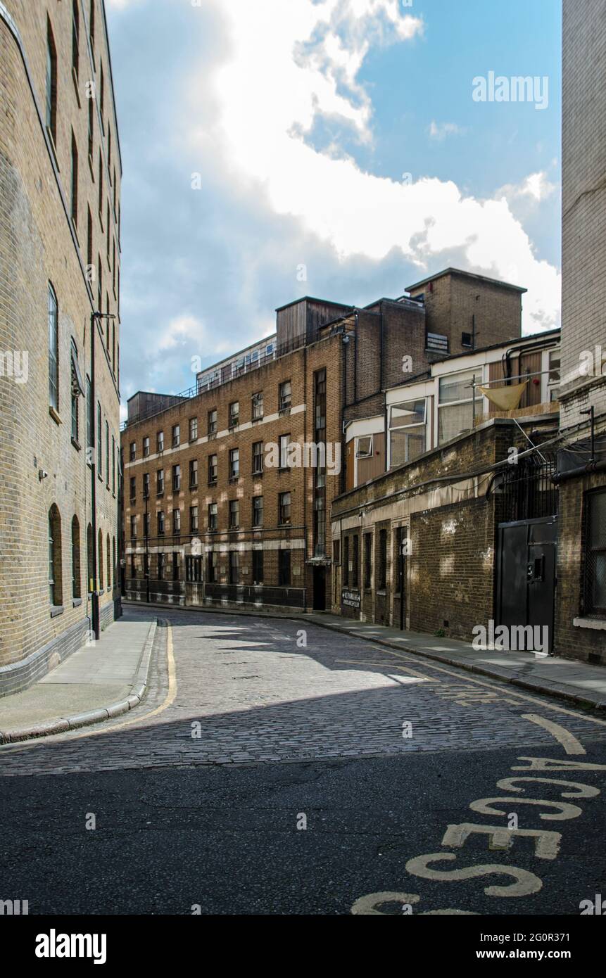 A narrow road in the Kings Cross district of London with run down ...