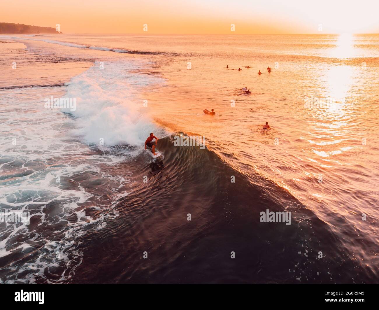 1 June 2021. Bali, Indonesia. Aerial view with surfing on barrel wave ...