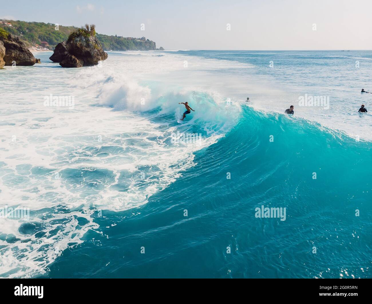 1 June 2021. Bali, Indonesia. Aerial view with surfing on barrel wave ...
