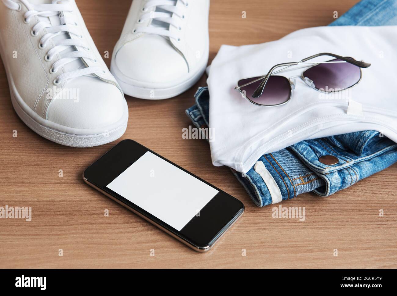 Stylish female clothes set. Woman outfit on wooden background. Online ...