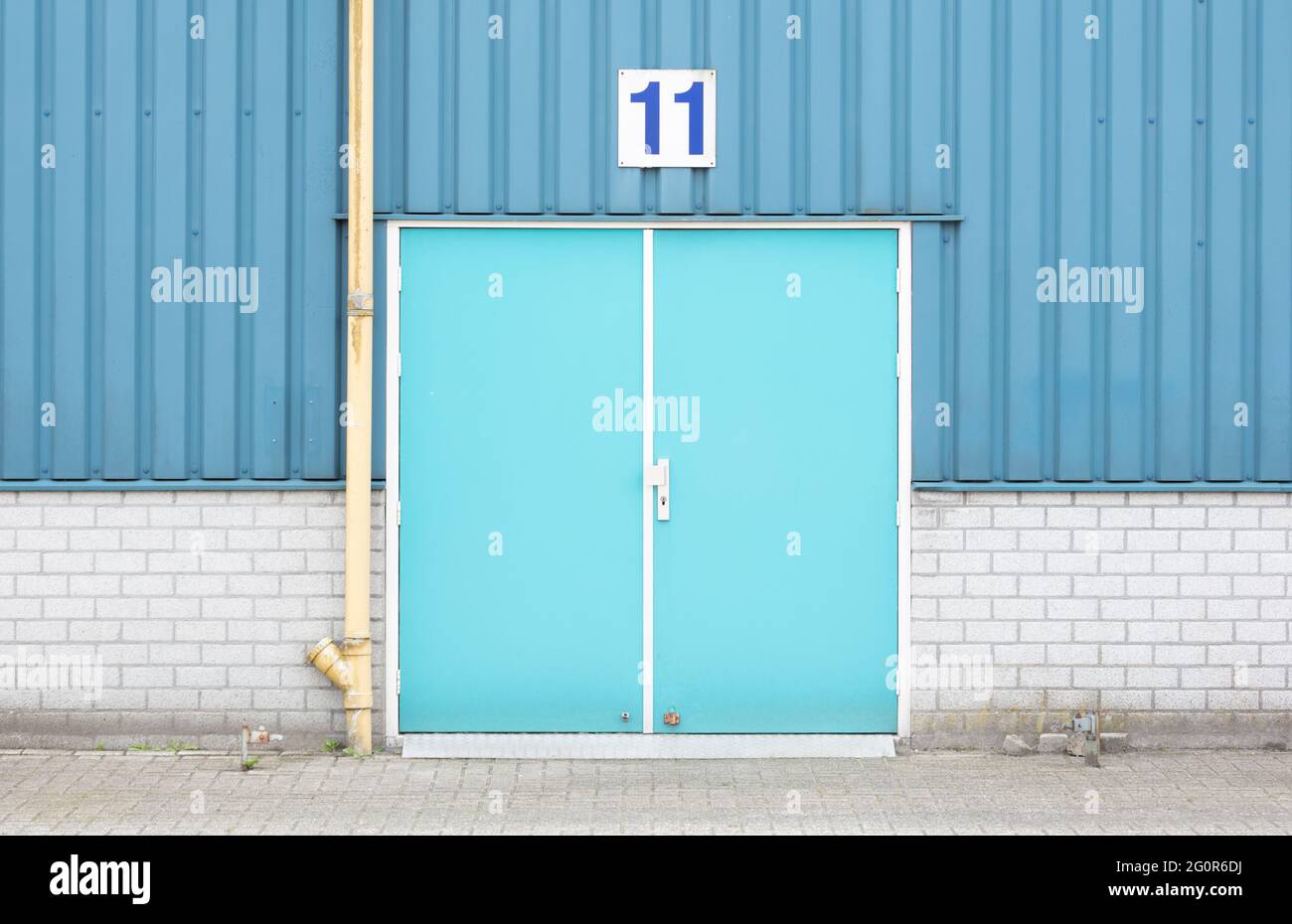 Old steel double doors, entrance to an industrial building Stock Photo ...