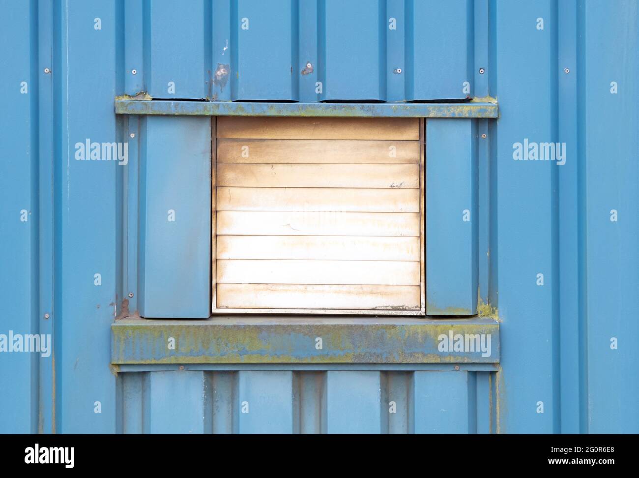 Old air vent in an abandoned building, rusted an in need of maintenance ...