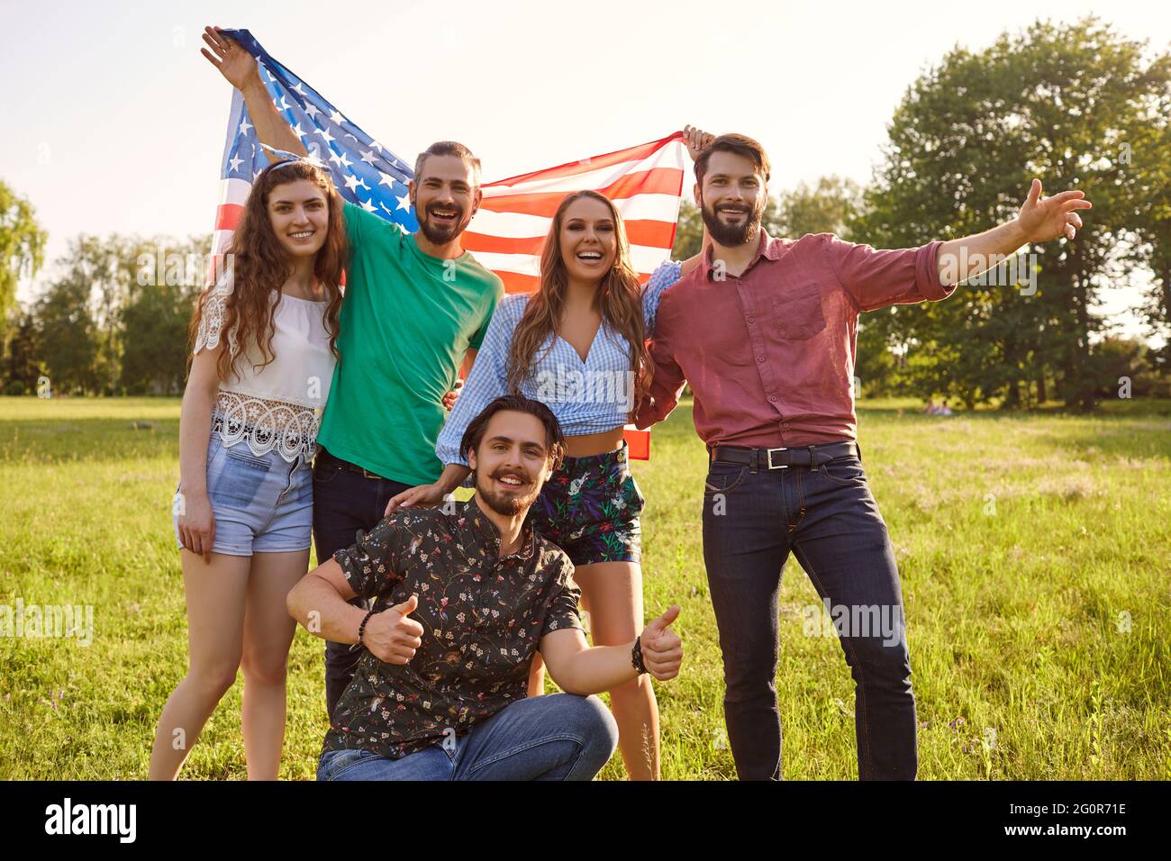 Group of young people with american flag celebrate america independence ...