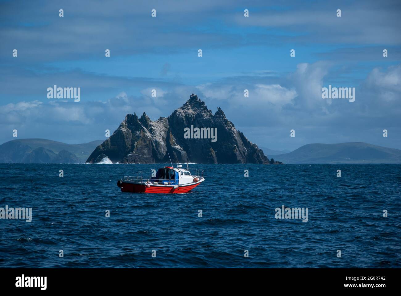 Boat floating along infant of Little Skellig Island in the Atlantic ...