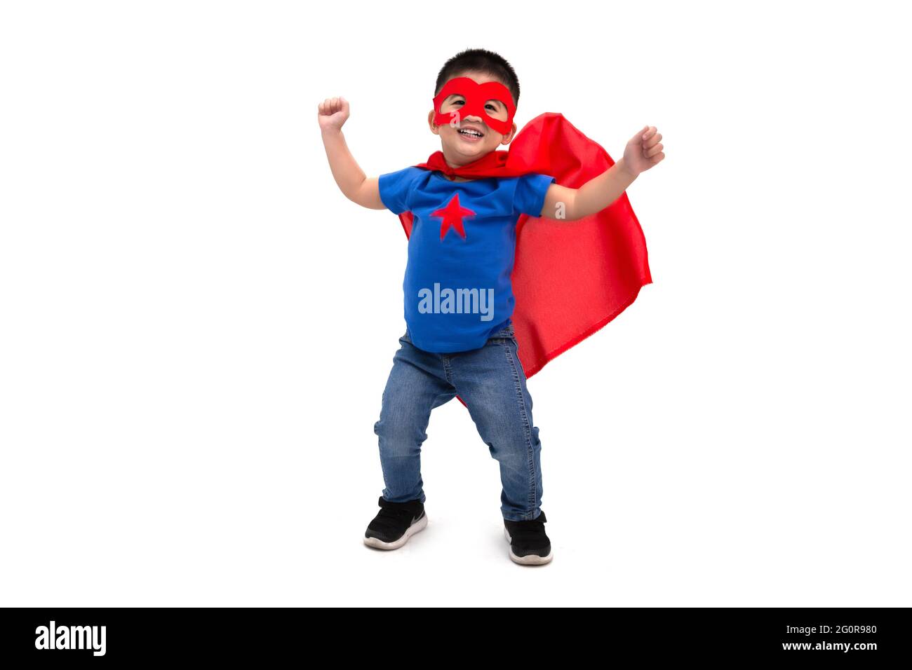 Asian boy with funny little power of hero isolated on white background ...
