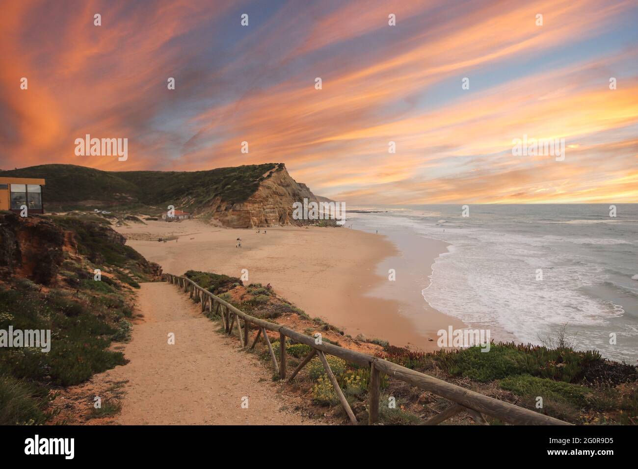 Beautiful sandy ocean beach and cliff at the sunset. Panorama atlantic ...