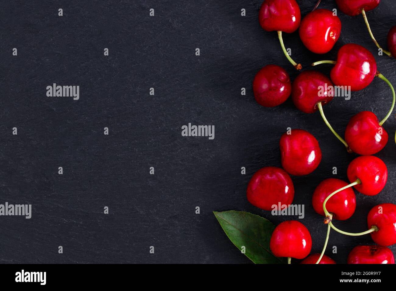 cherry on dark background with copy space. Top view. Flat lay Stock ...