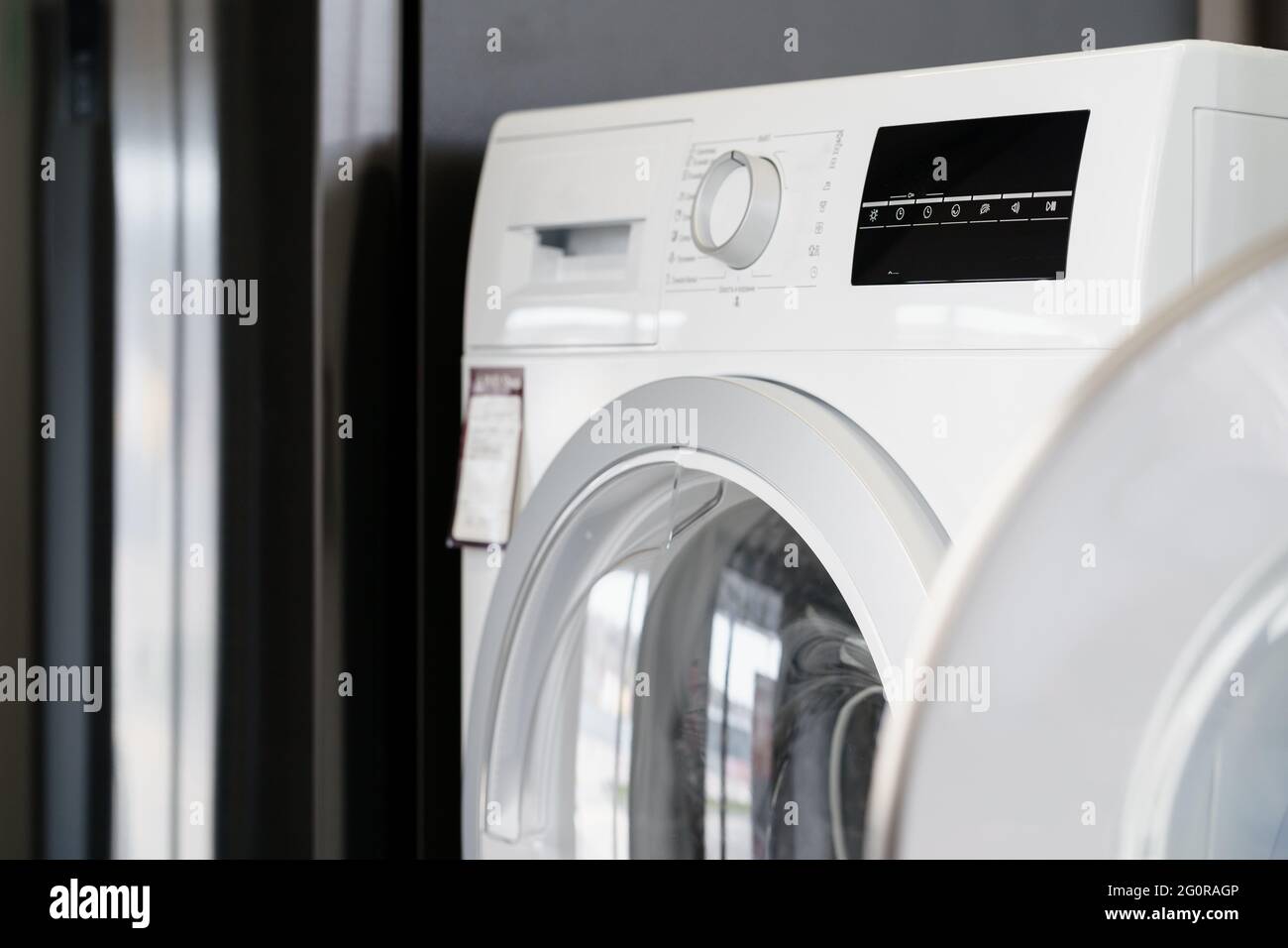 Close up of new dryer machine in household appliances store Stock Photo ...