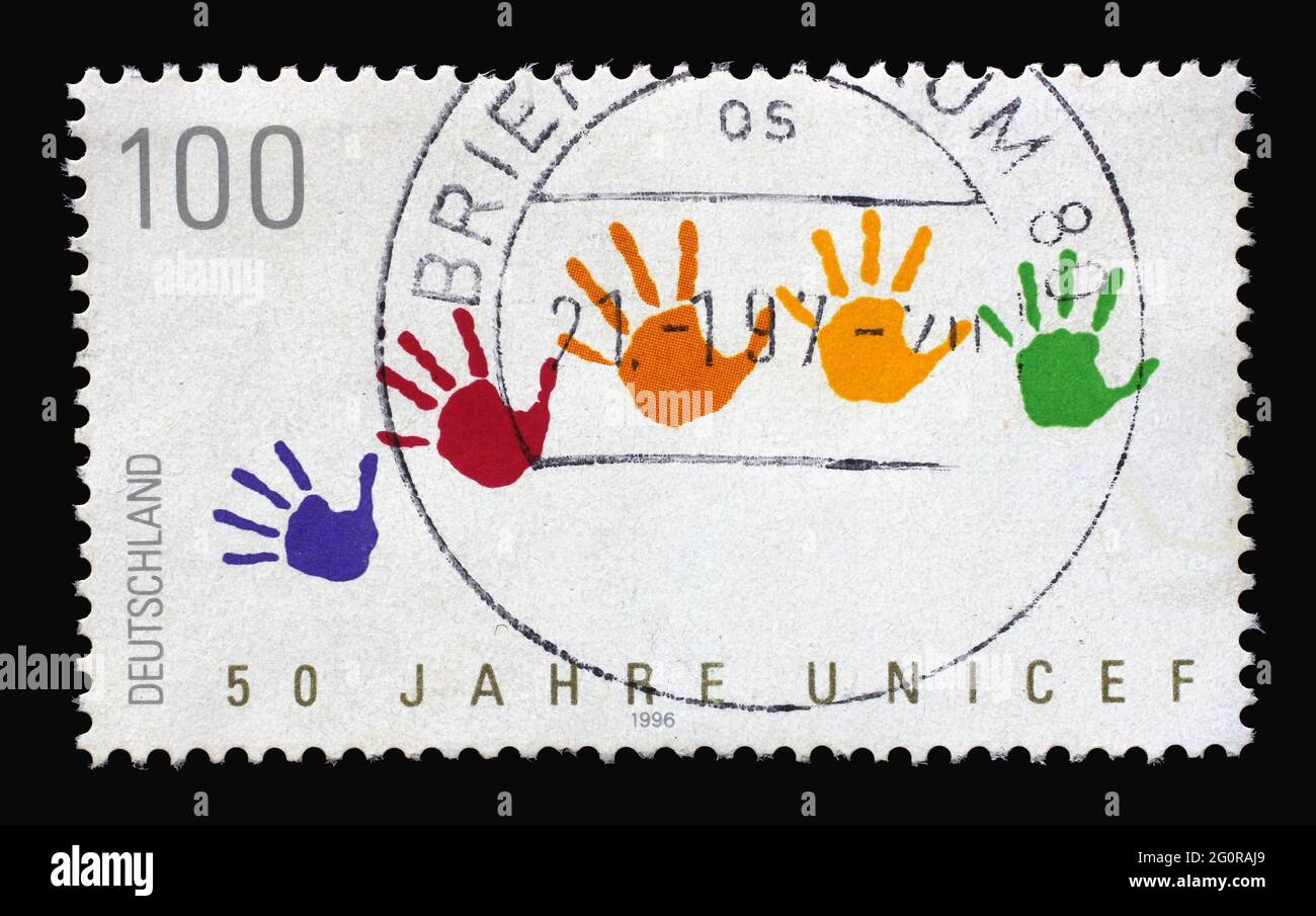 A stamp printed in Germany shows Color prints from children's hands ...