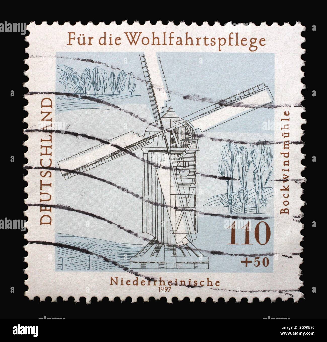 A stamp printed in Germany shows Post mill, Lower Rhine, Water and ...