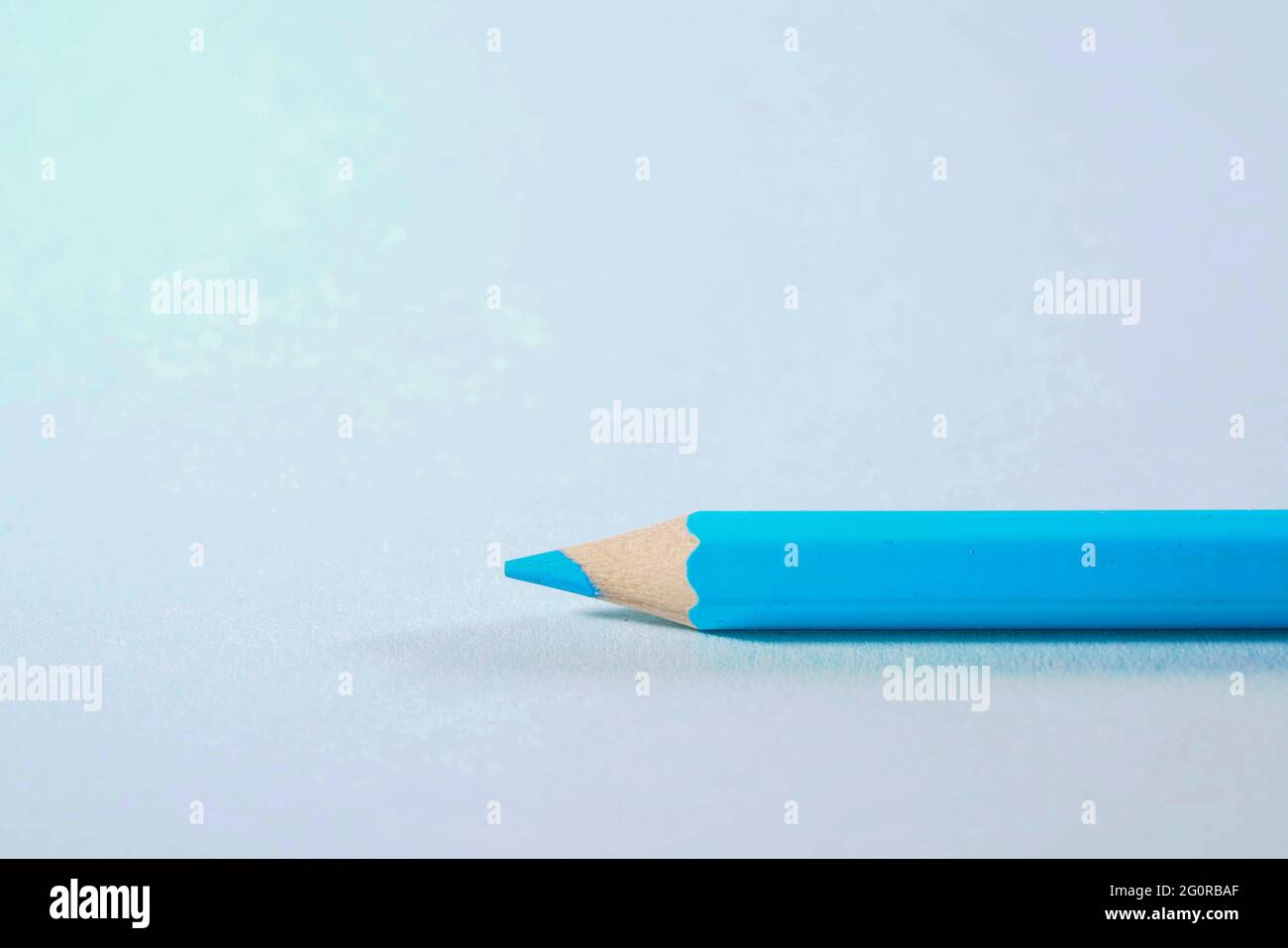 Colorful crayons, pencils with plain paper as a background with ...