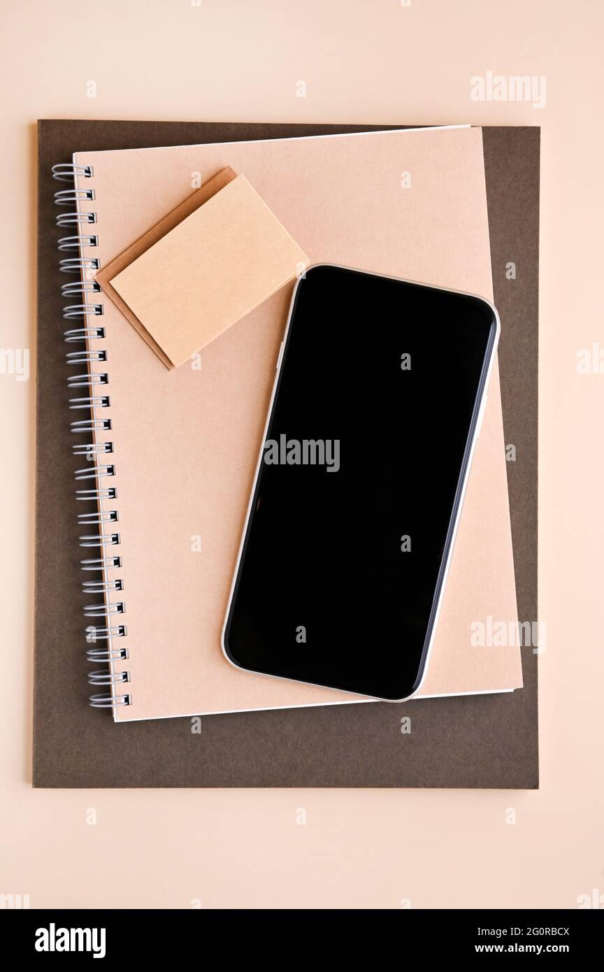 Black mobile smartphone mockup and stationery made from recycled ...