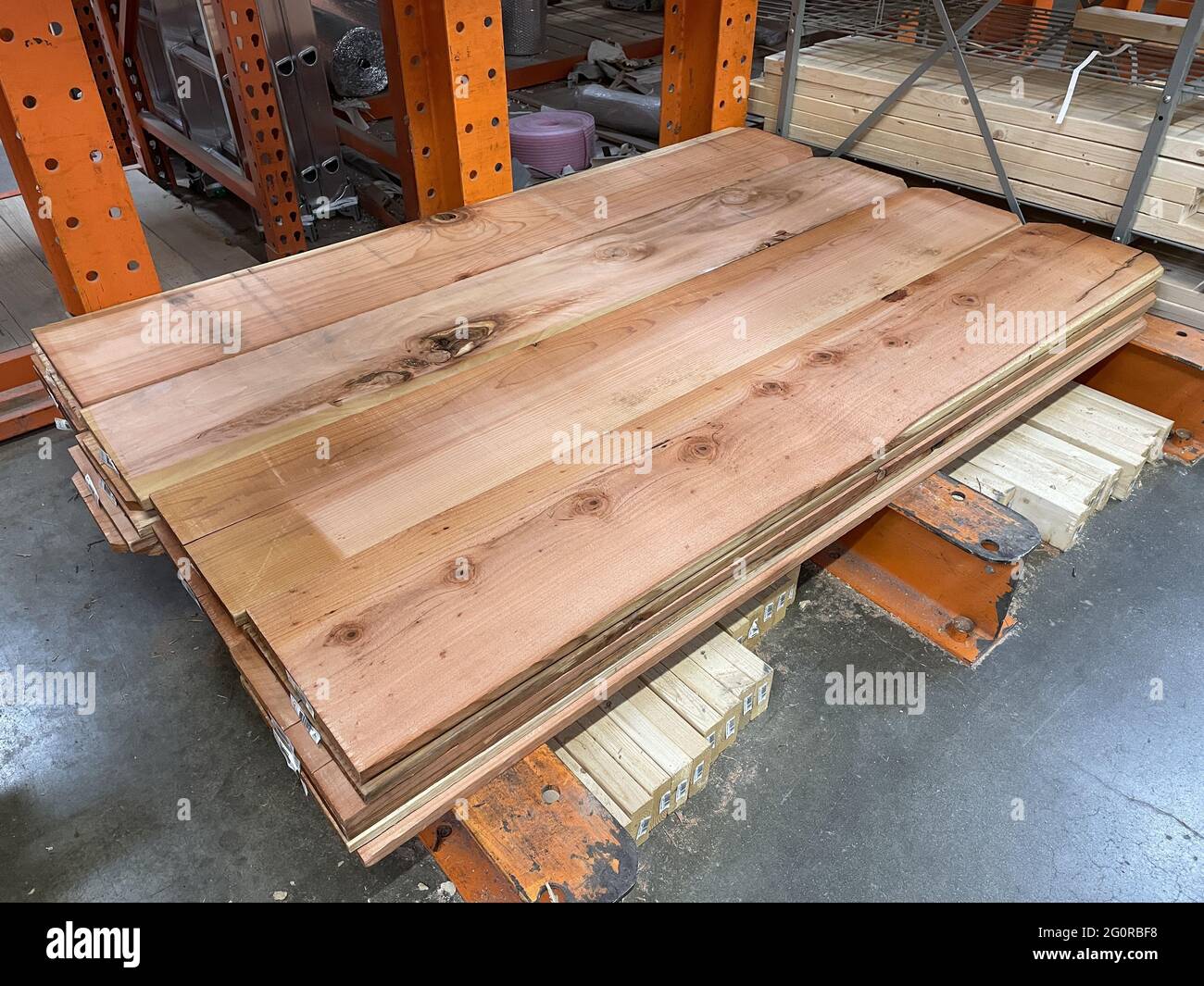 Stacks of new redwood picket fence boards on patio Stock Photo - Alamy