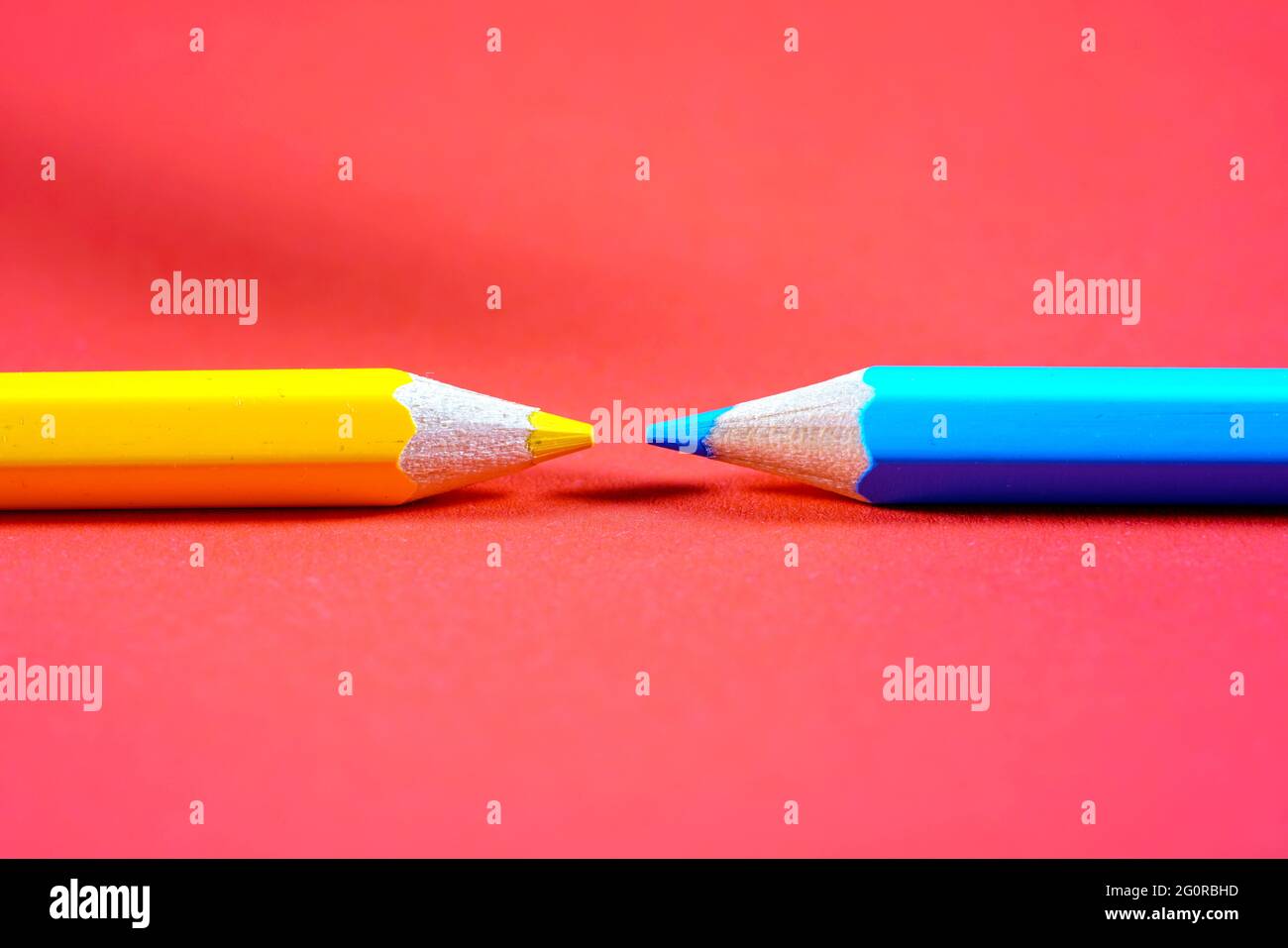 Colorful crayons, pencils with plain paper as a background with ...