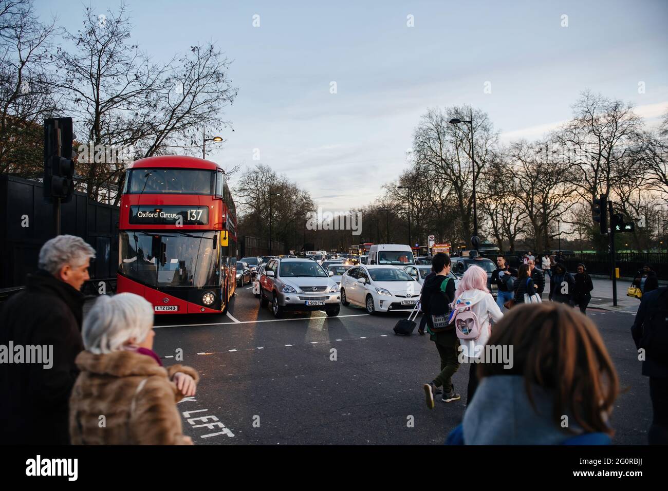 Busy street at dusk in London capital with double decker bus Stock ...