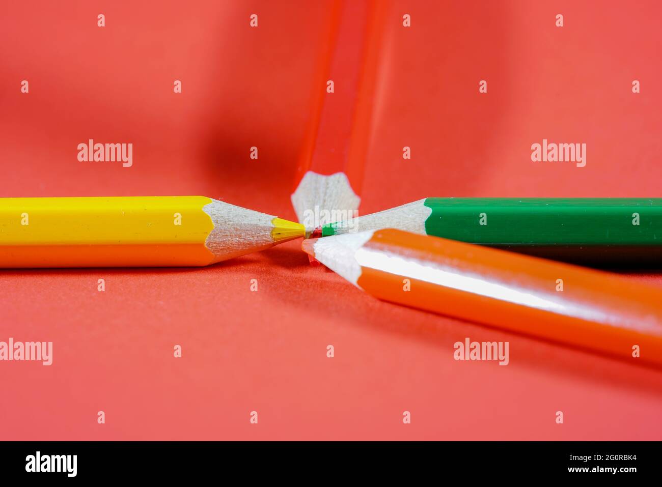 Colorful crayons, pencils with plain paper as a background with ...