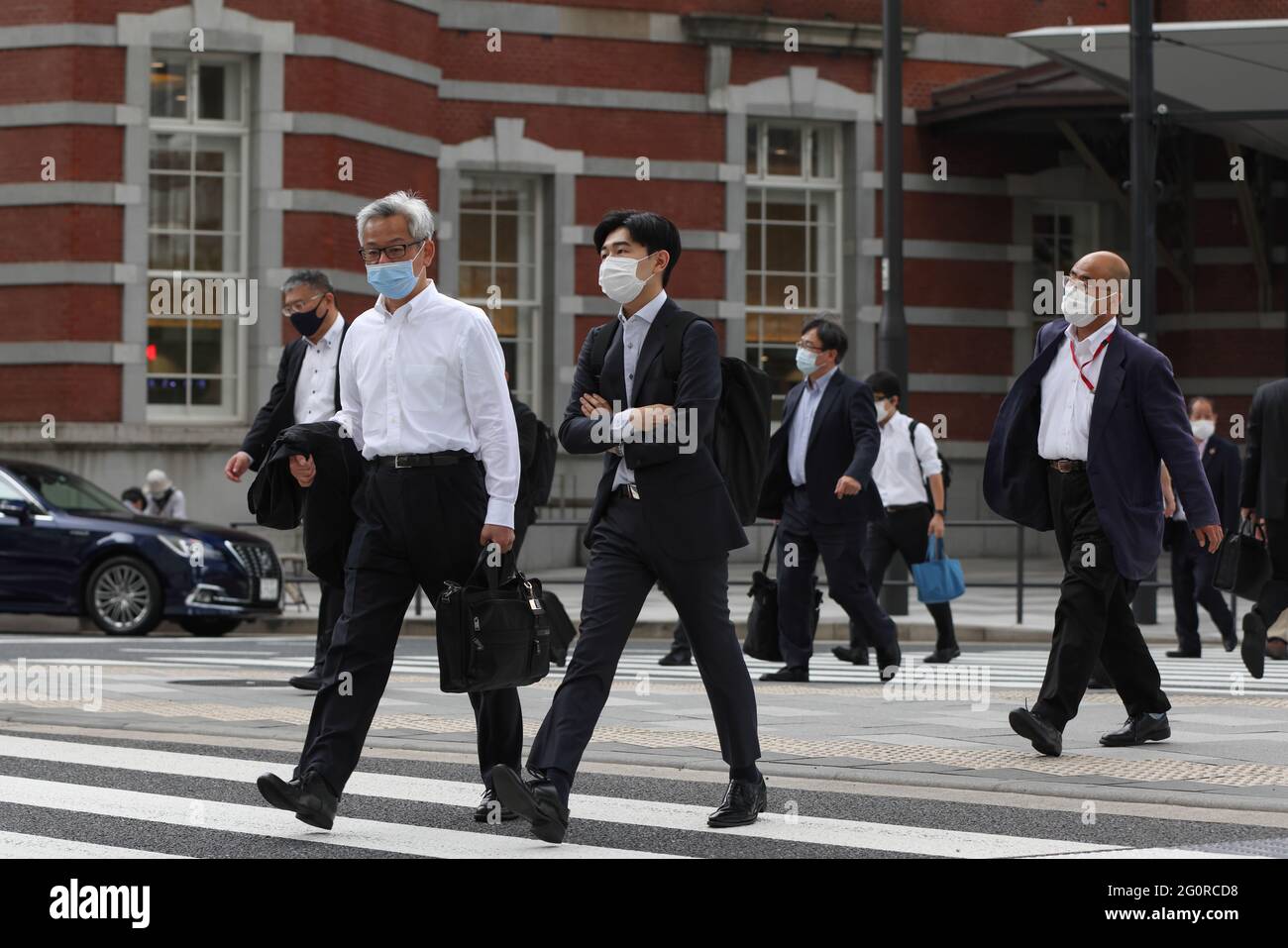 Tokyo, Japan. 02nd June, 2021. Pedestrians wearing face masks as a ...