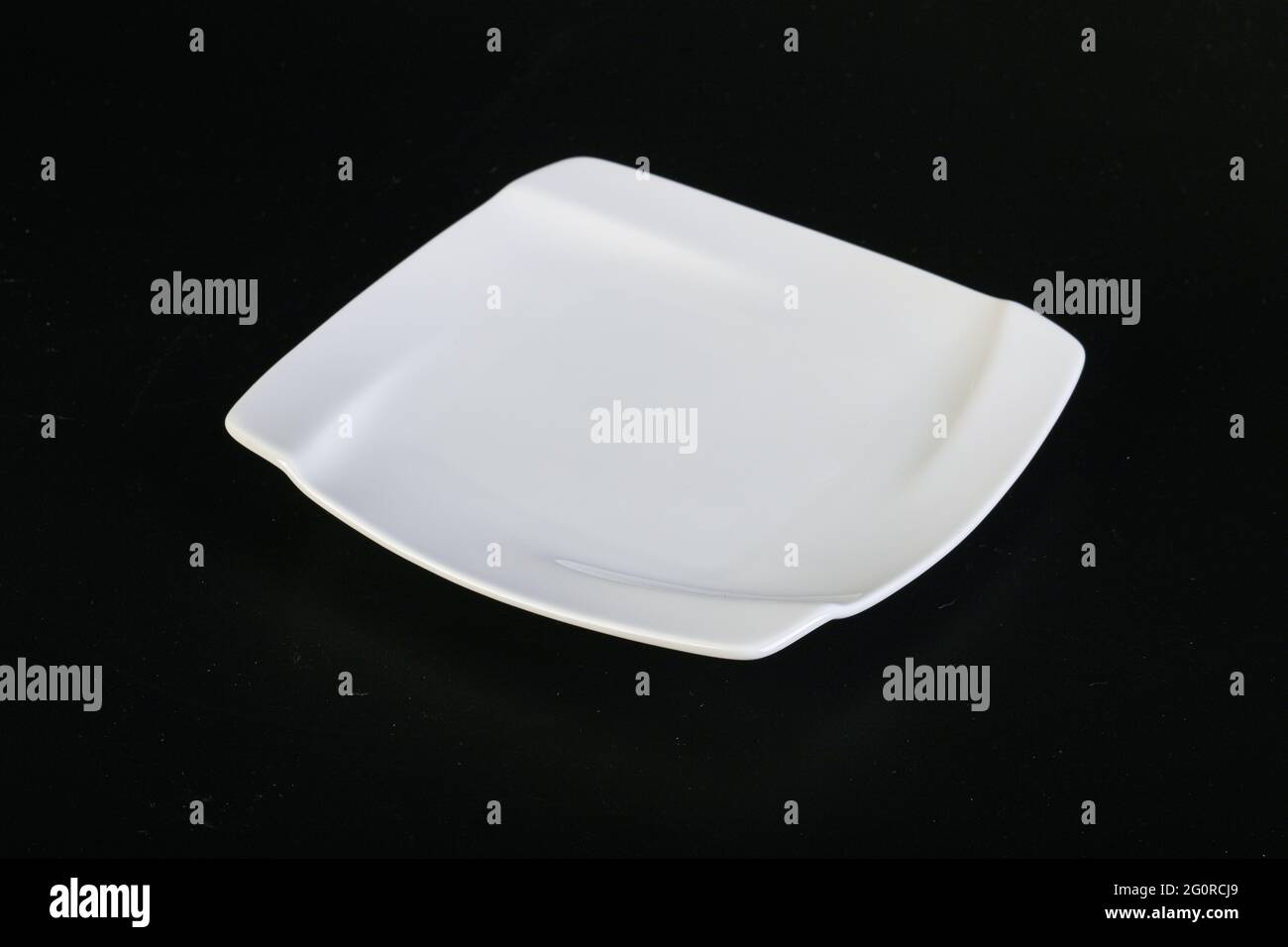 White empty plate for serving isolated Stock Photo - Alamy